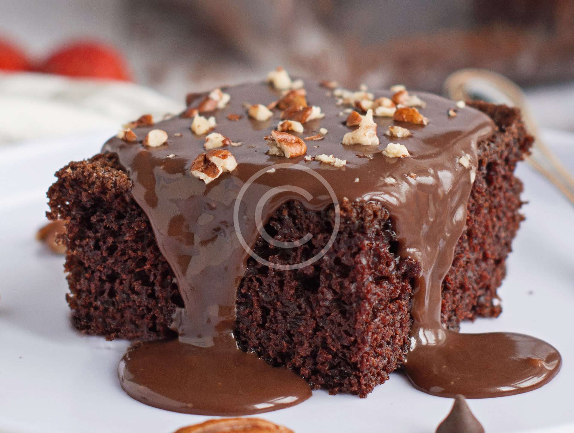 Soft sponge cake with dark chocolate topping and nuts – Aly32 Pastry